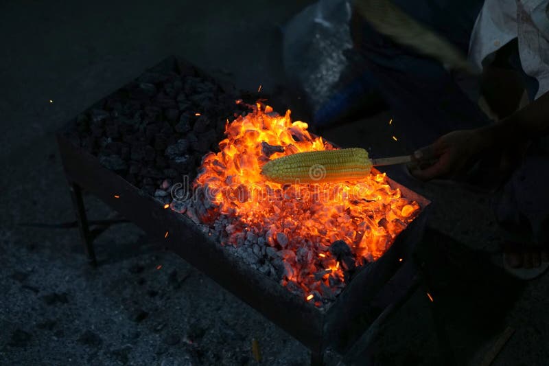 Grilling Corn on a Burning Charcoal Stove Stock Photo - Image of ...