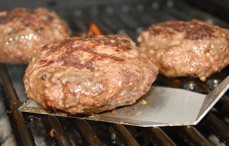 Grilling hamburger time. stock photo. Image of grill, summer - 4740068