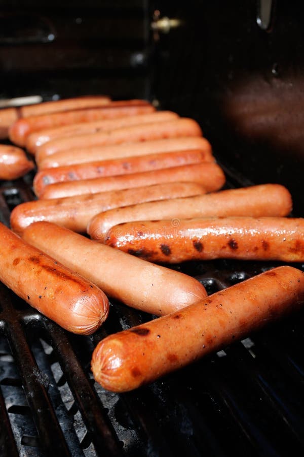 Grilling Hot Dogs stock image. Image of meat, broil, barbeque - 9923563