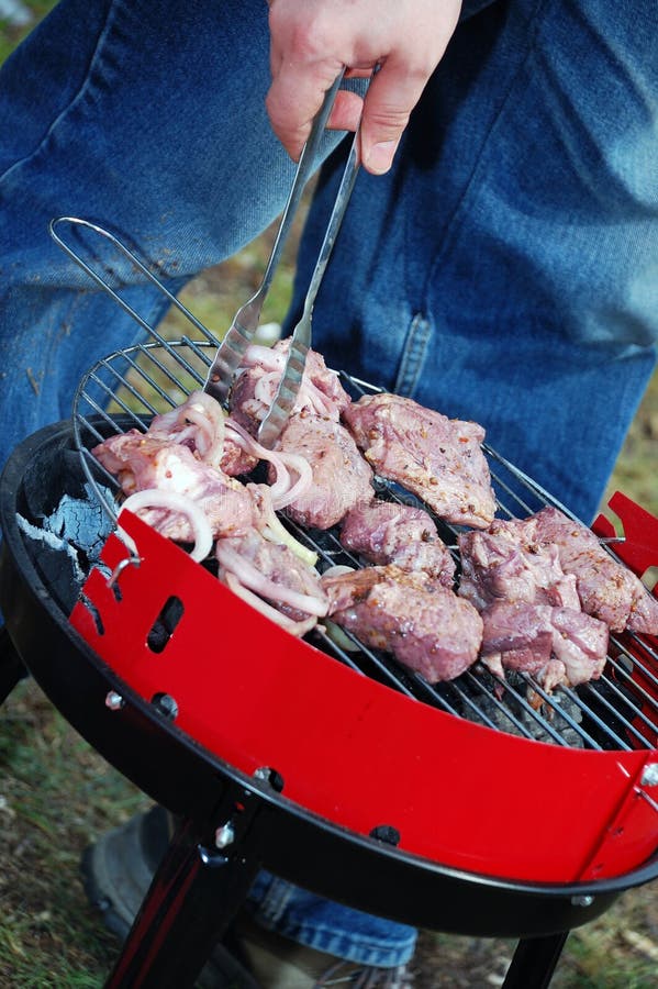 Grilling Meat stock image. Image of jeans, dinner, outdoors - 9230303