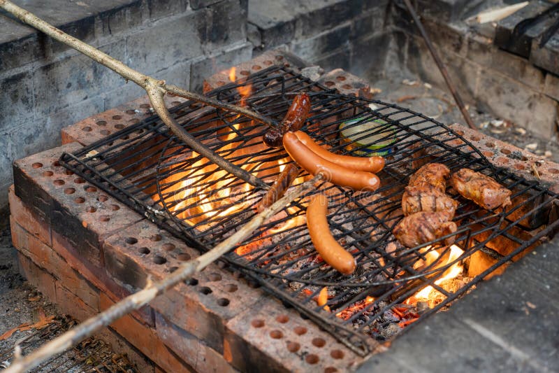 Grilling Sausages and Meat Over Open Fire.. Stock Image - Image of traditional, fire: 376141169