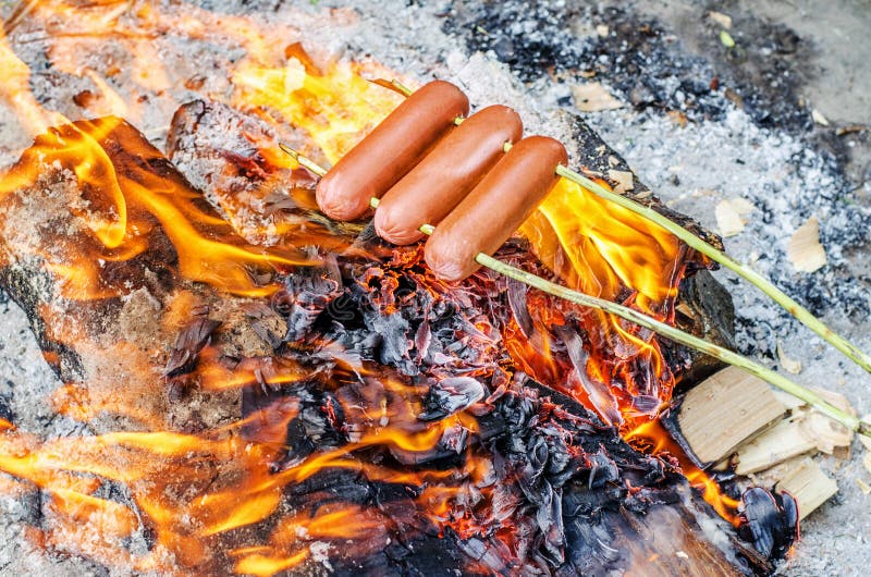 Grilling Sausages Over an Open Fire Outdoors Stock Photo - Image of ...