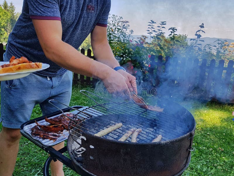 Young People Grilling Outdoors Stock Photo - Image of grill, eating ...