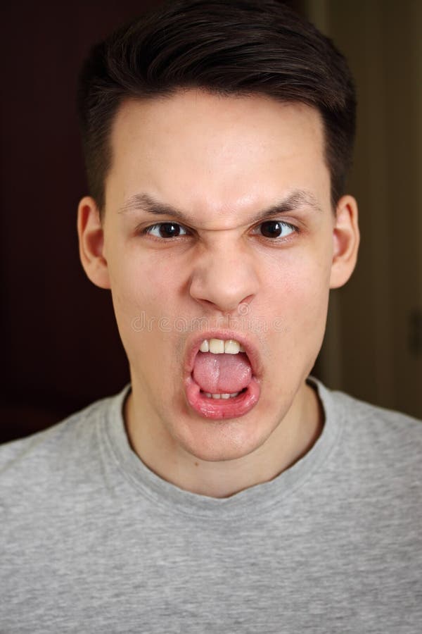 Grimace on his face stock image. Image of open, hand - 56926187