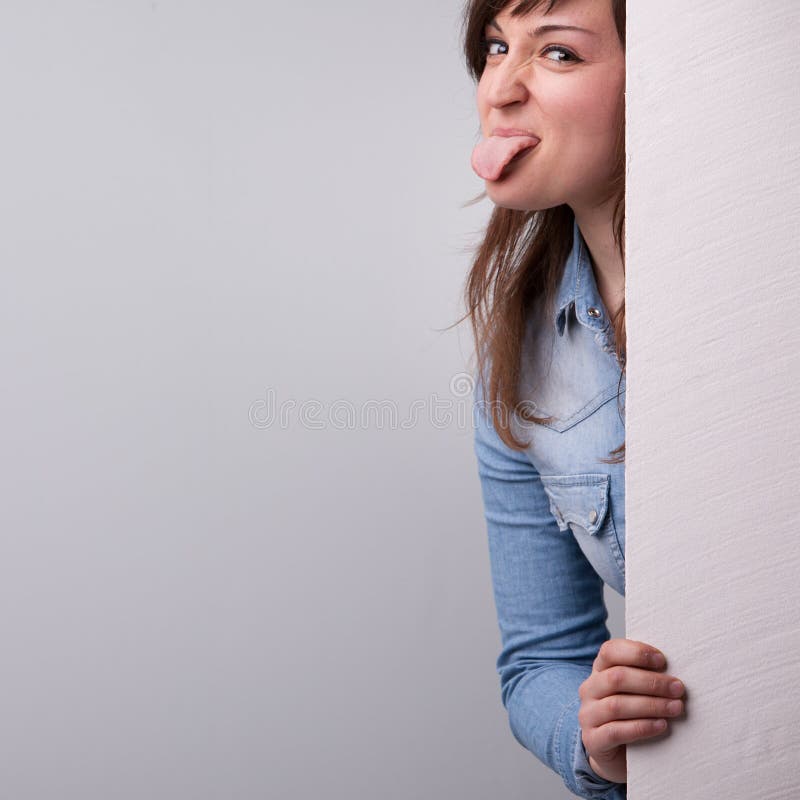 Grimace of a Woman Showing Up Behind the Wall Stock Image - Image of ...