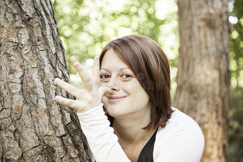 Girl mocking tree stock image. Image of caucasian, casual - 45000165