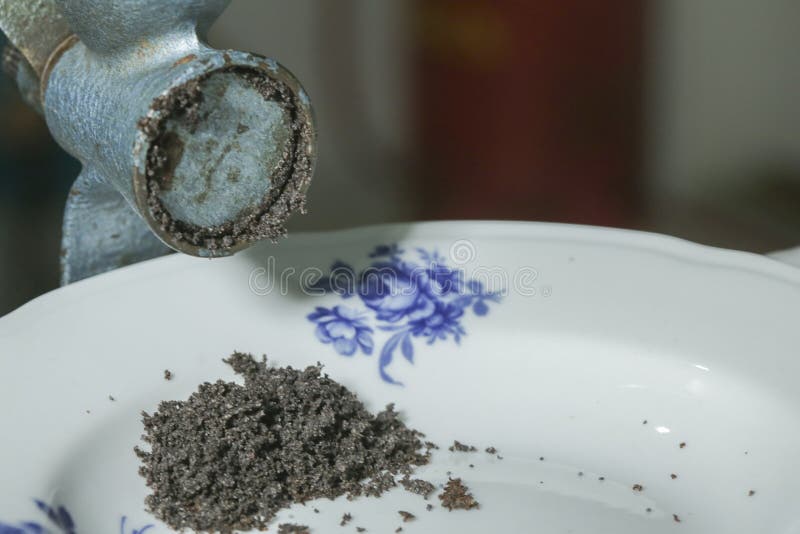 Grind Poppy with Grind Machine. Ground Poppy Stock Image - Image of ...