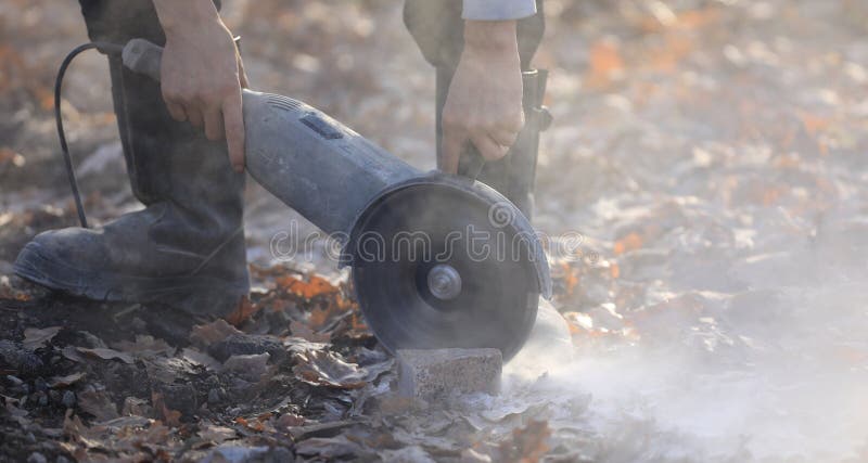 Grinder Worker Cuts a Stone the Electric Tool, Construction Work Stock ...