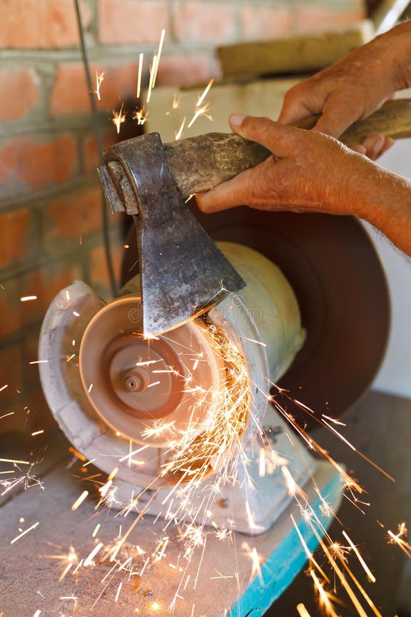Grinding Bench Axe Using a Grinding Machine Stock Photo - Image of ...