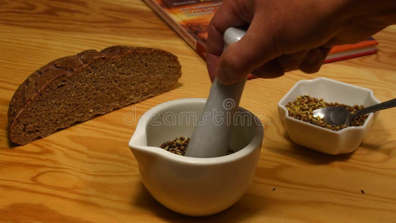 Grinding a Bread Spice in a Mortar for Baking a Bread Stock Video ...