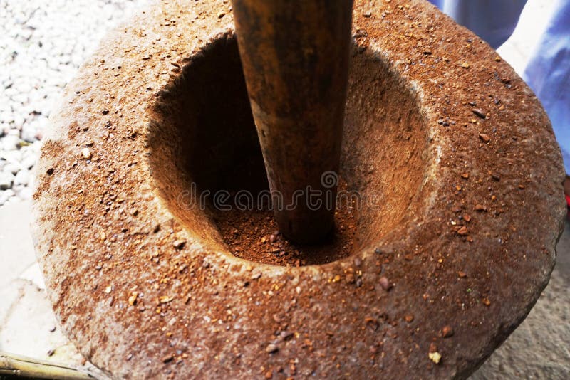 Grinding Coffee with a Stone Mortar. Stock Image - Image of place ...