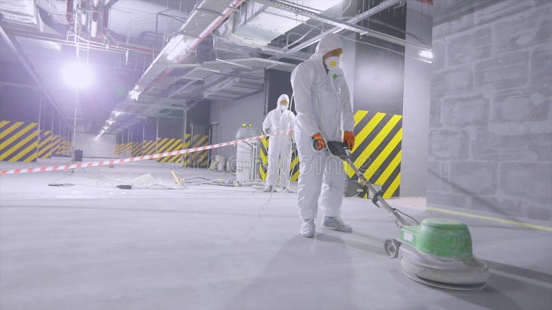 Grinding a Concrete Floor with a Grinder. Builder Works Concrete Floor ...