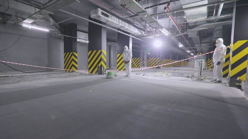 Grinding a Concrete Floor with a Grinder. Builder Works Concrete Floor ...