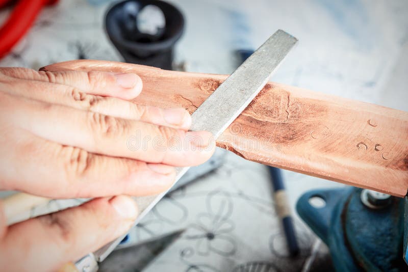 Grinding the Copper Billet with a File Stock Photo - Image of grind ...