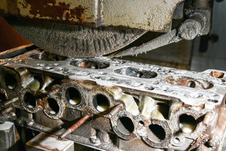 Grinding the Cylinder Head of the Engine on a Surface Grinder Stock ...