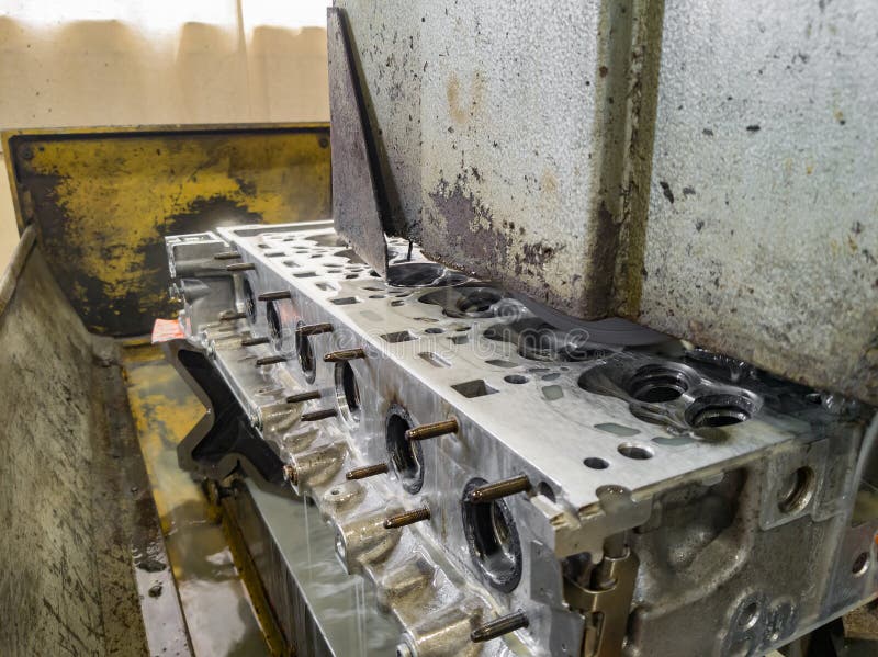 Grinding the Head of a Six-cylinder Engine on a Surface Grinder Stock ...