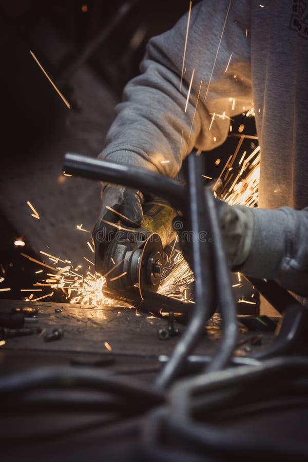 Grinding Loops of Steel Pipe with Many Sparks on a Work Table Stock ...