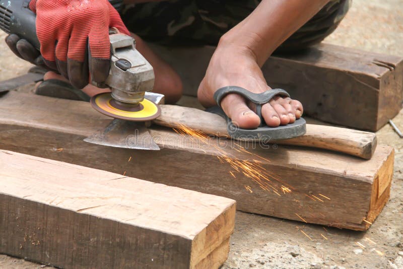Grinding Machine Being Used To Remove Rust on Axes. Stock Image - Image ...