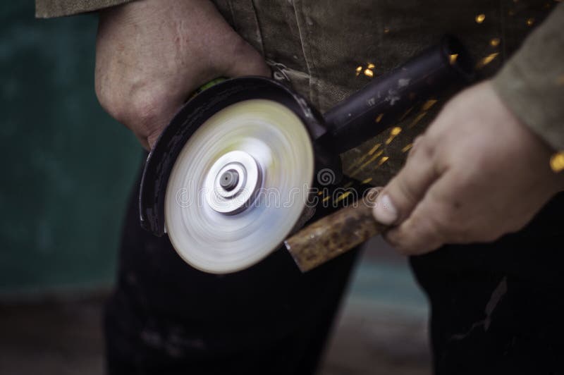 Grinding machine in hand stock photo. Image of industry - 146940332