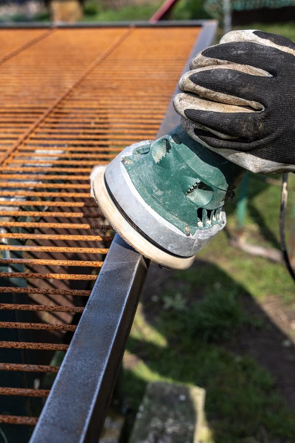 Grinding of a Metal Grid Using a Vibrating Sander Stock Photo - Image ...