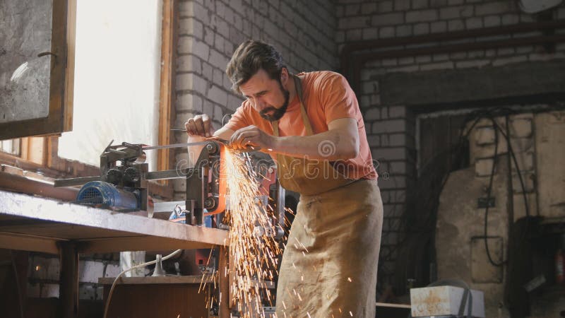 Grinding Metal Tools with Sparkles - Forge Workshop Stock Image - Image ...