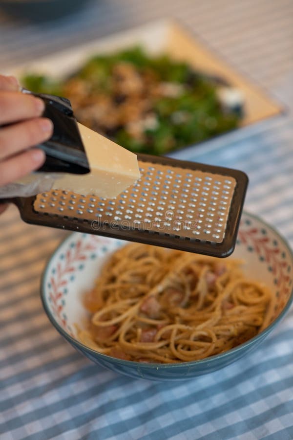 Grating Parmesan Cheese To Carbonara Stock Photo - Image of food, grind ...