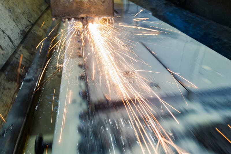 Grinding the Plate on a Surface Grinding Machine. Sparks and Water ...