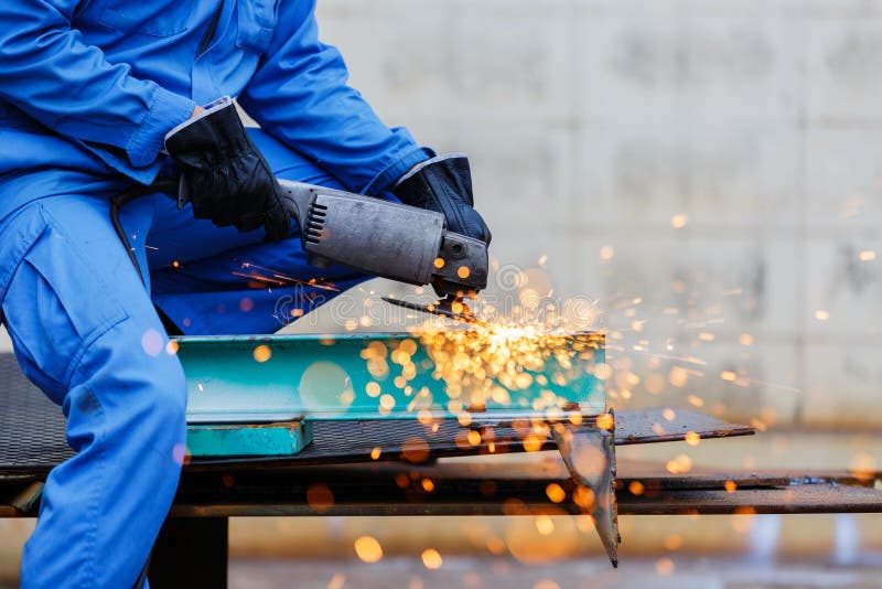 Worker Grinding Steel by Electric Grinding Machine Stock Photo - Image ...