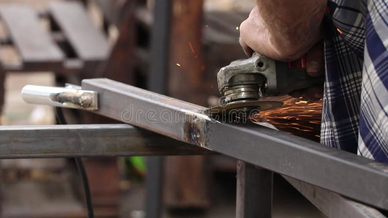 Grinding a Weld on Metal Structures with a Grinder, Work of a Master on ...