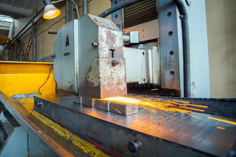 A Grinding Wheel Produces Metal Scrap on the Machine. Stock Photo ...