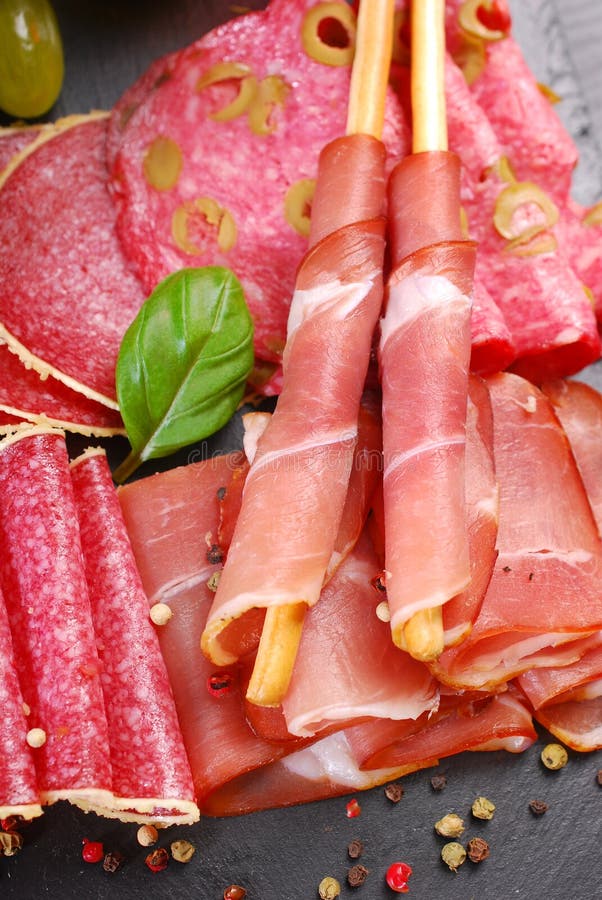Grissini Stick Bread with Ham on Black Board with Appetizers Stock ...