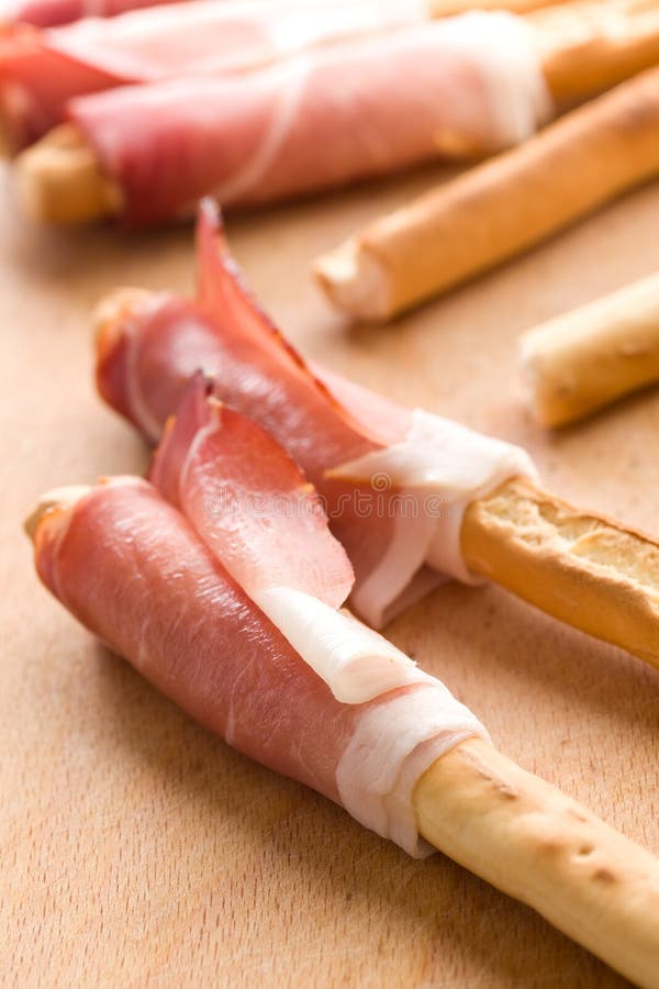 Grissini sticks with ham stock image. Image of diet, smoked - 17021743