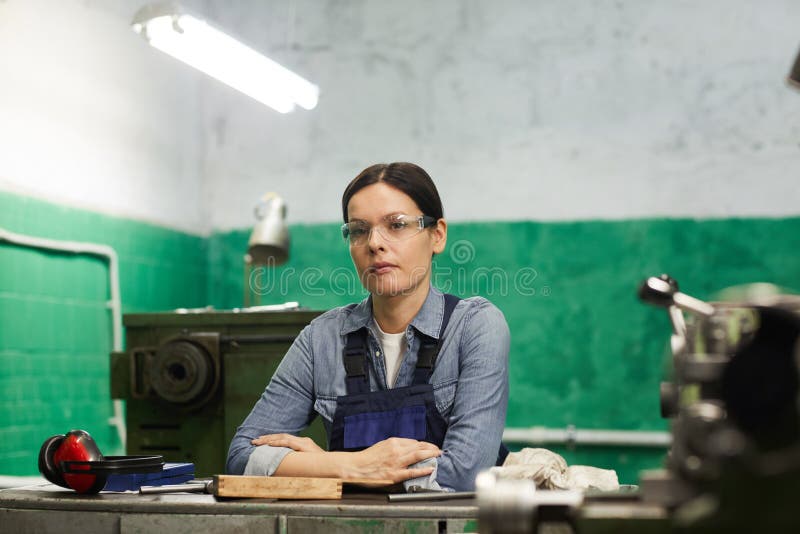 Gritty woman at factory stock photo. Image of mechanic - 250112678