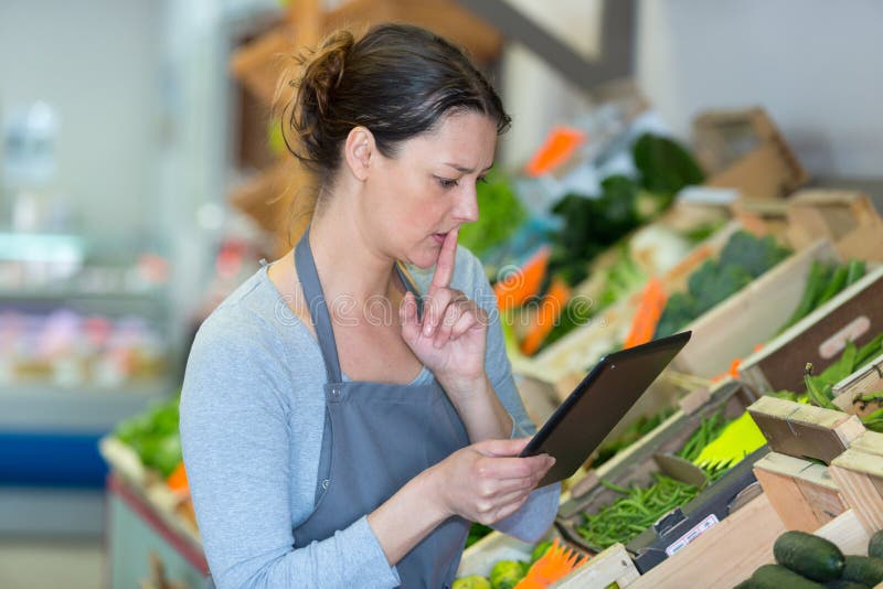 Grocery Store Staff with Clipboard in Grocery Store Stock Photo - Image ...