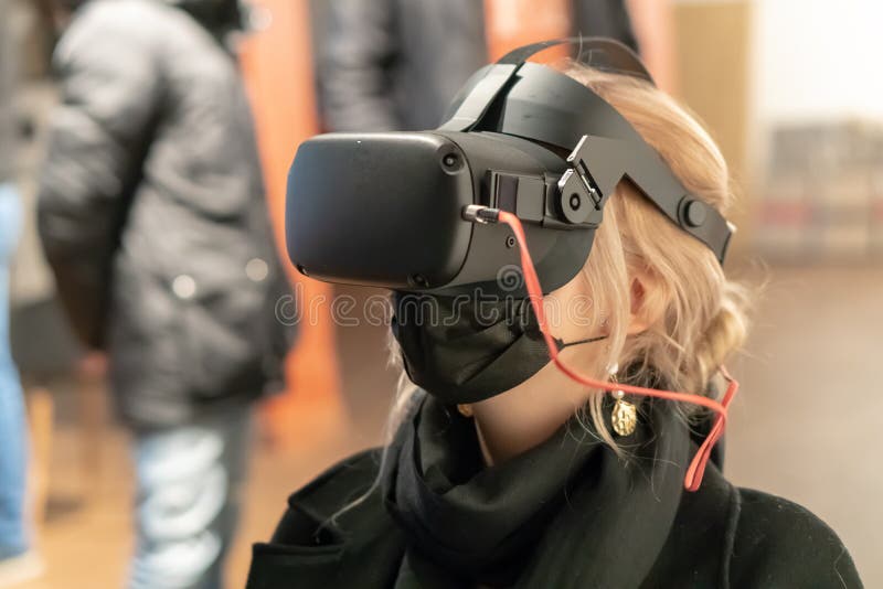 Young Girl in a Virtual Reality Glasses. Using VR Technologies in ...