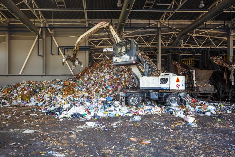 Excavator on Primary Sorting of Garbage at Waste Processing Plant ...