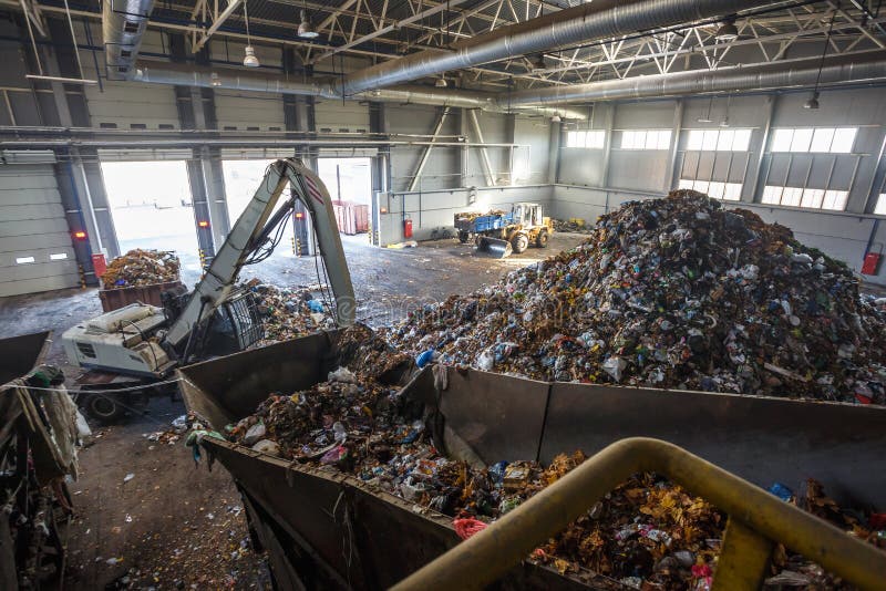Excavator on Primary Sorting of Garbage at Waste Processing Plant ...
