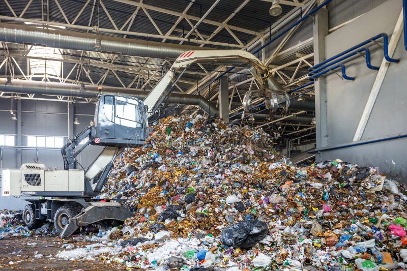 Excavator on Primary Sorting of Garbage at Waste Processing Plant ...