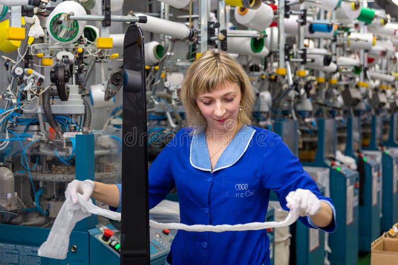 A Female Employee Performs Visual Quality Control of the Lace Ribbon ...
