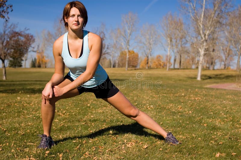 Groin stretch stock photo. Image of exercise, tanned, grass - 3388020