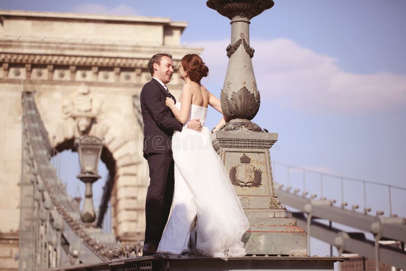 Groom and Bride on a Bridge Stock Photo - Image of hands, love: 52554834
