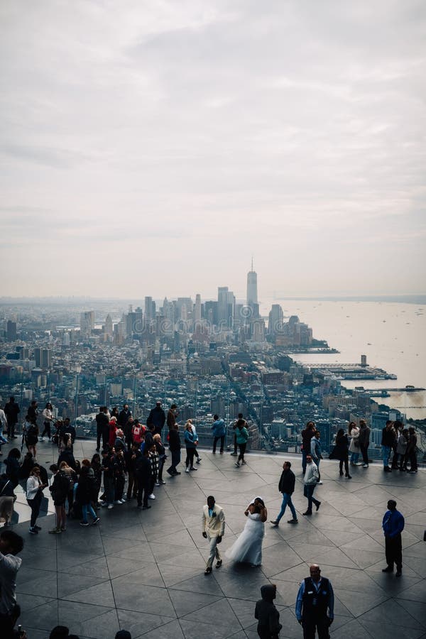 And Bride Dancing on the Rooftop of a Skyscraper with a City View in ...