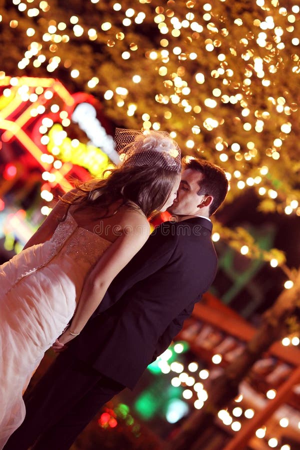 Bride and Groom Kissing in Fog with Purple Night Sky Stock Image ...