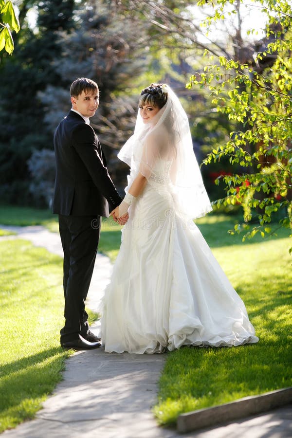 Groom and the Bride during Walk in Their Wedding Day Stock Photo ...
