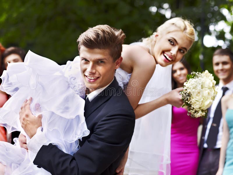 Groom Carries His Bride Over Shoulder. Stock Image - Image of bride ...