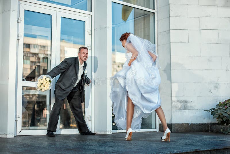 Groom Does Not Let the Bride at a Wedding. Stock Photo - Image of ...