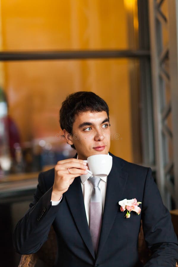 Groom drinking coffee stock image. Image of hands, love - 64653221