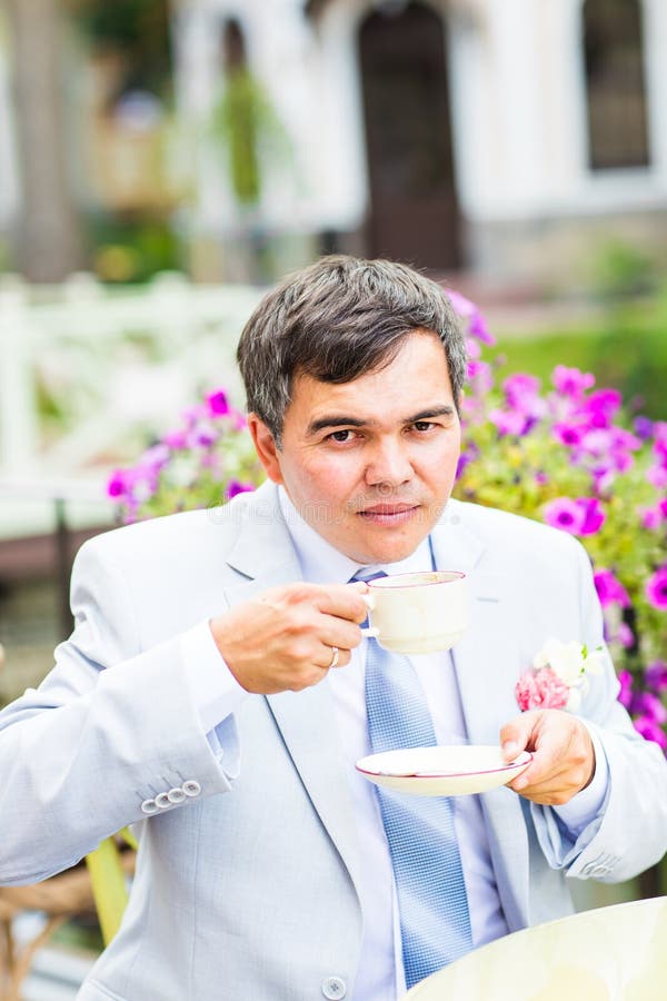 Groom Drinking Coffee at an Outdoor Cafe Stock Photo - Image of female ...