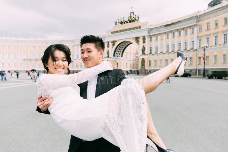 Groom holding bride stock image. Image of groom, love - 82529741