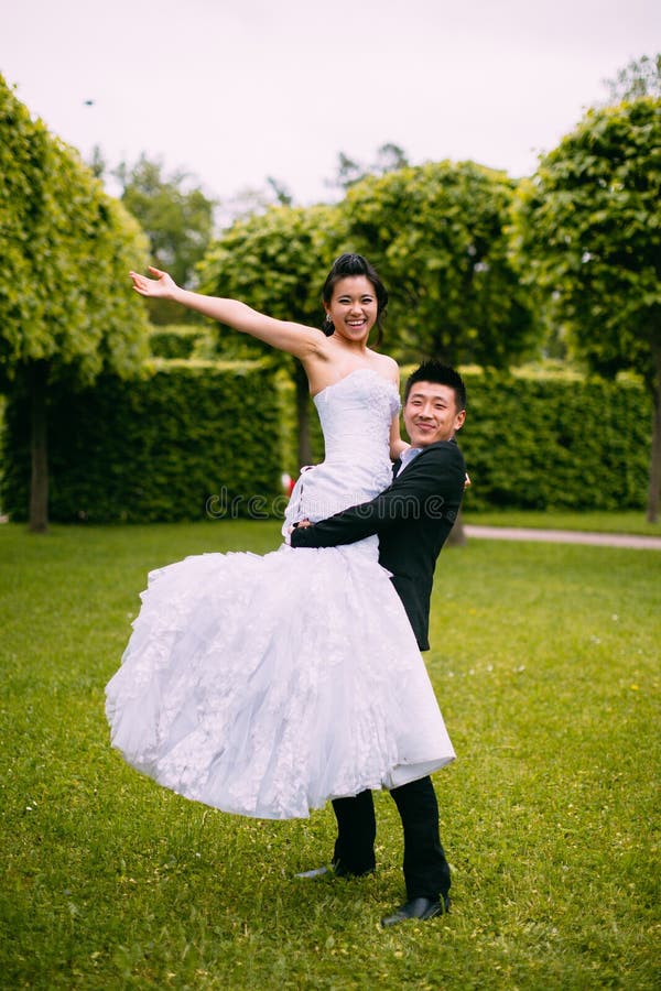 Groom holding bride stock photo. Image of contact, happy - 82910632